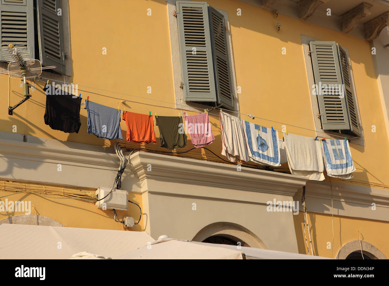 Typical Greek scene of washing hanging outside a building in Corfu Town ...