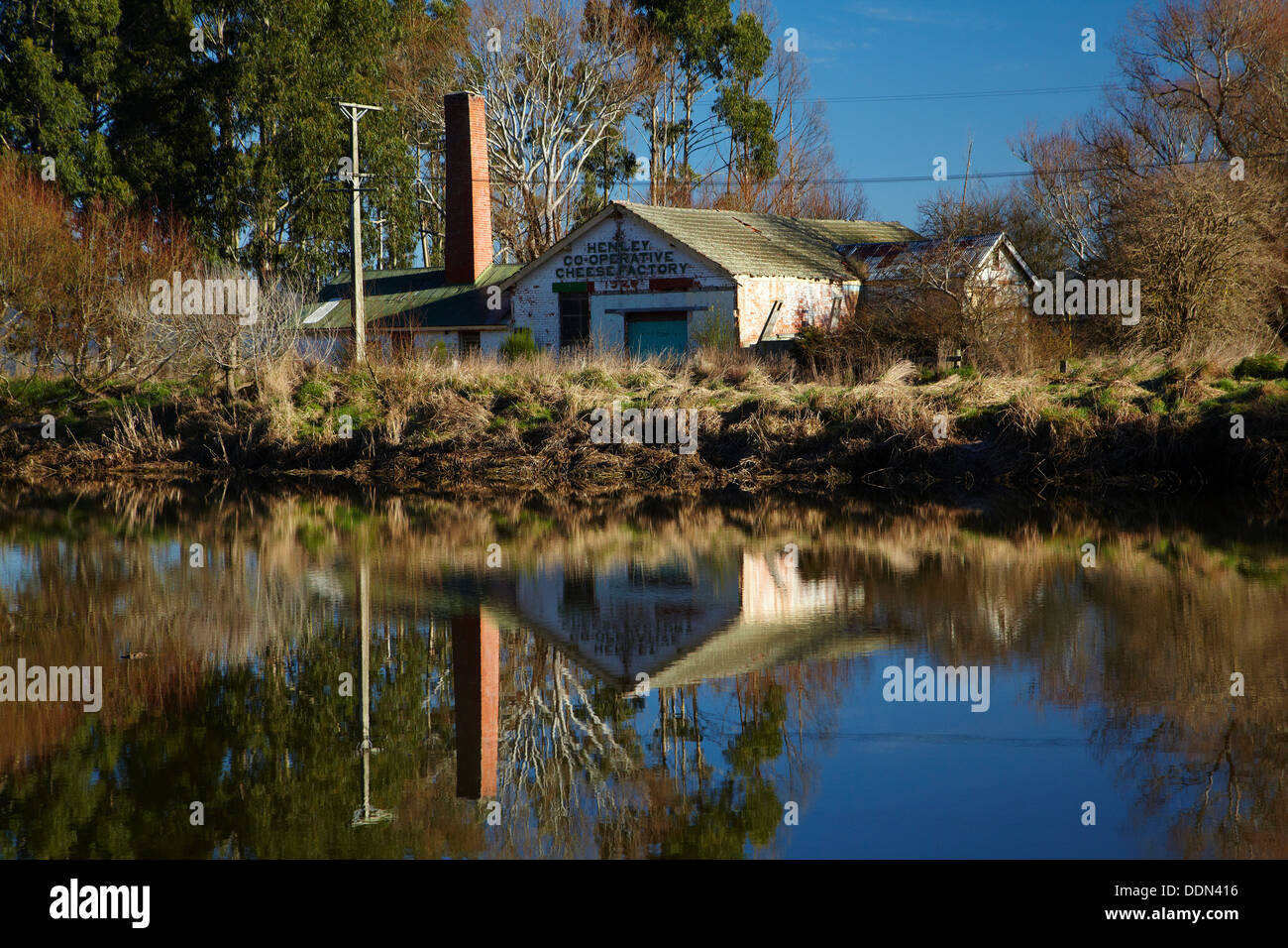 Old Henley Cheese Factory, reflected in Taieri River, Taieri Plains ...