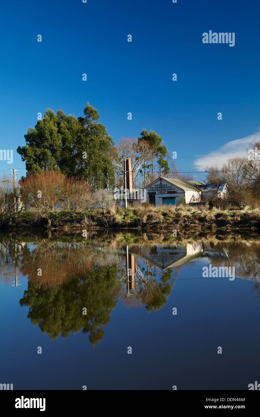 Old Henley Cheese Factory, reflected in Taieri River, Taieri Plains ...