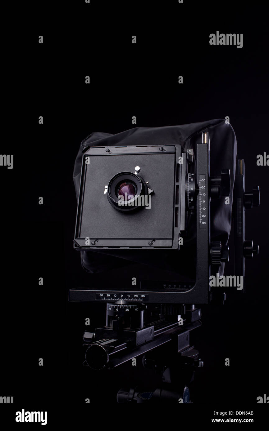 Old photo Camera on black background Stock Photo - Alamy