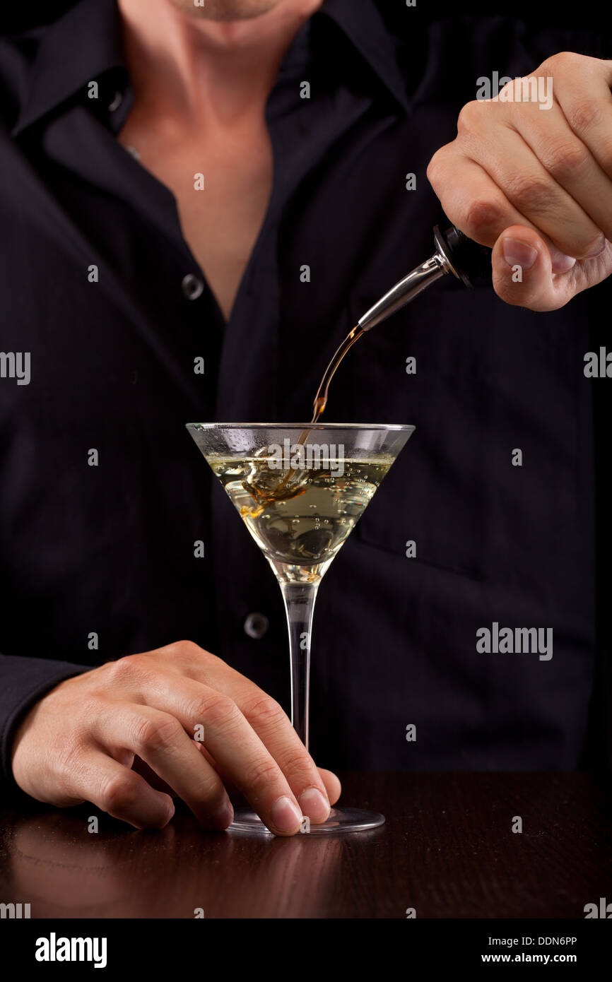 Bartender pouring alcohol crystal glass hi-res stock photography and ...