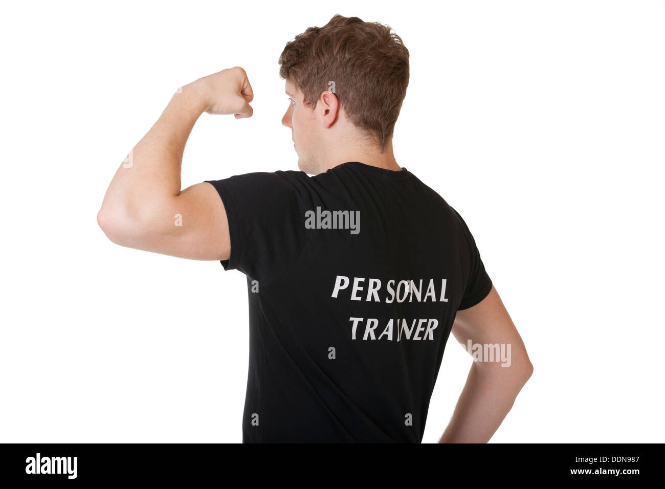 Personal trainer showing his biceps Stock Photo - Alamy