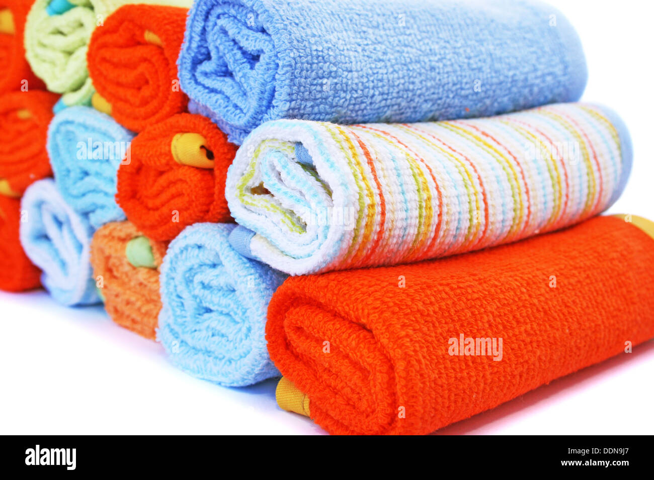 Colorful towels on white background Stock Photo - Alamy