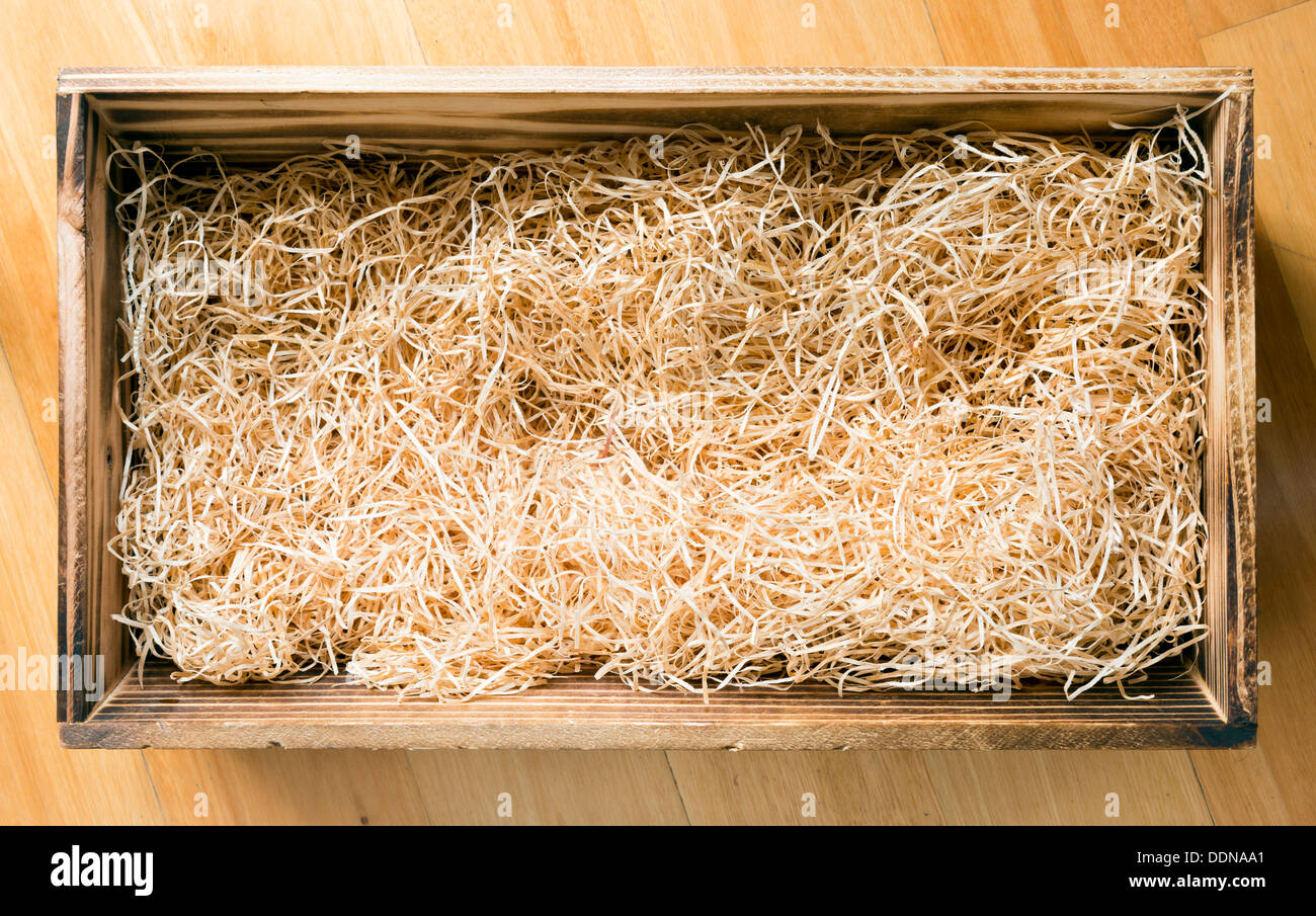 Wooden gift or display box filled with natural raffia or twine Stock ...