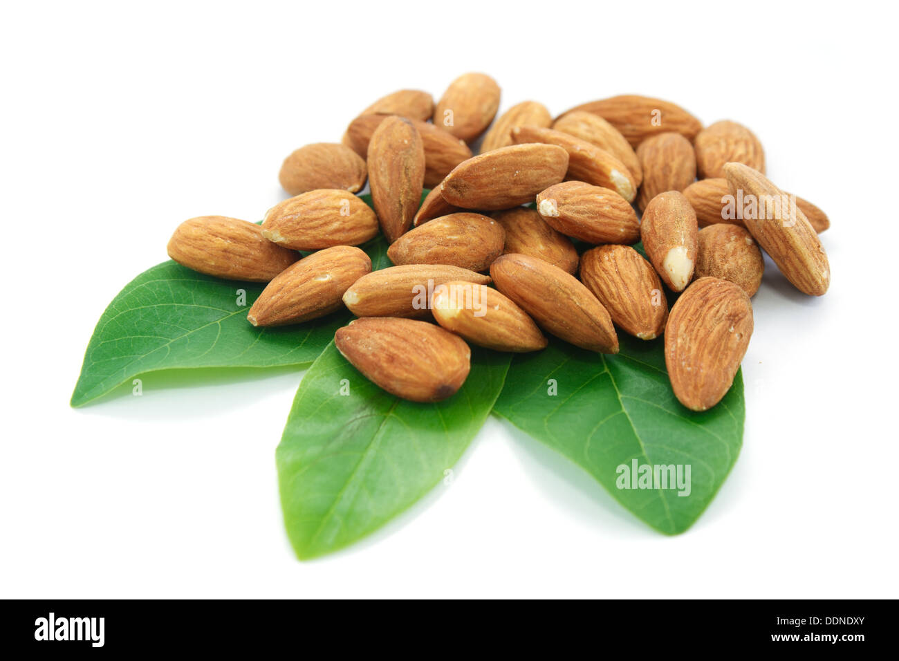 Almonds seeds on white background Stock Photo - Alamy