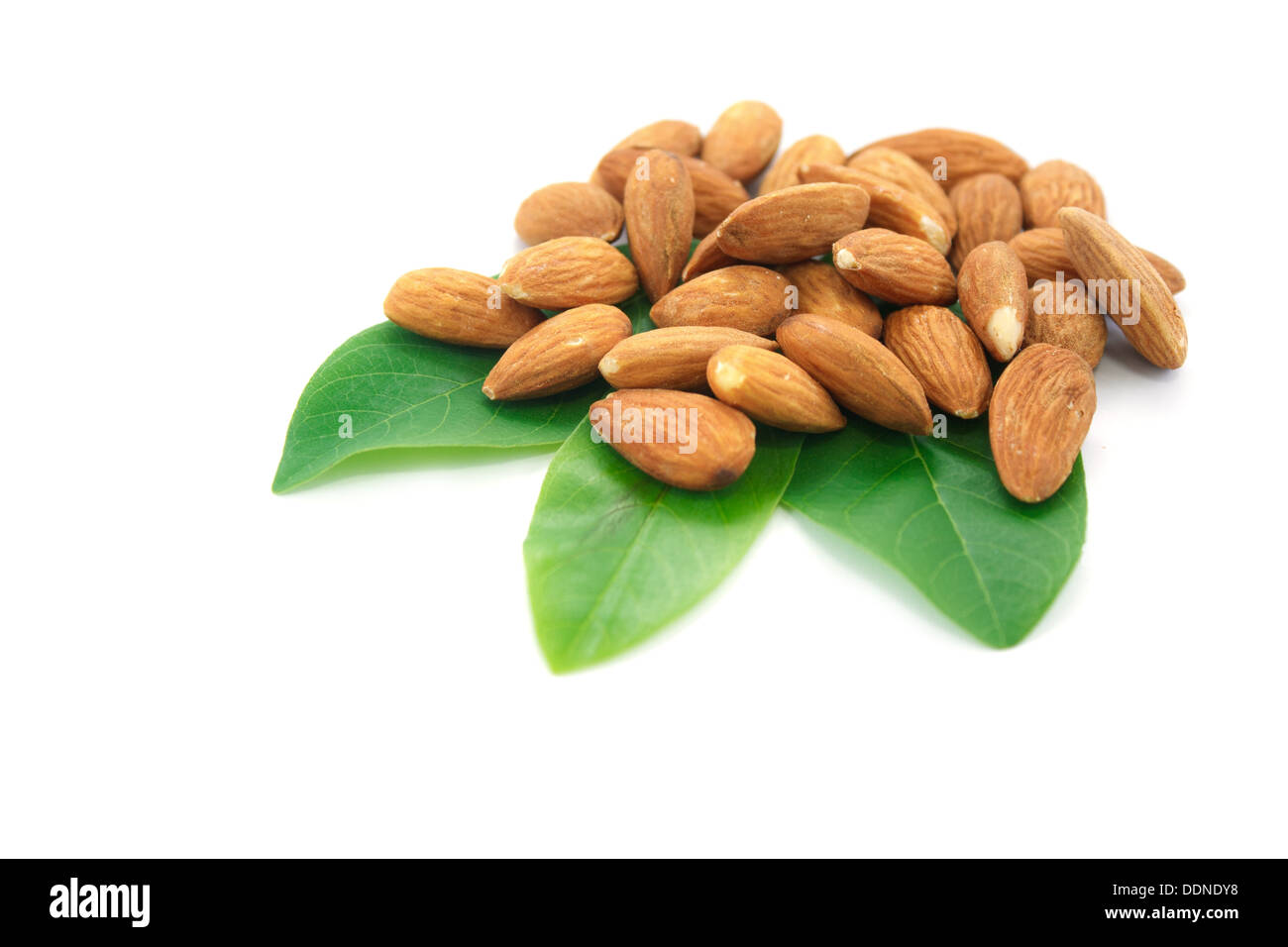 Almonds seeds on white background Stock Photo - Alamy