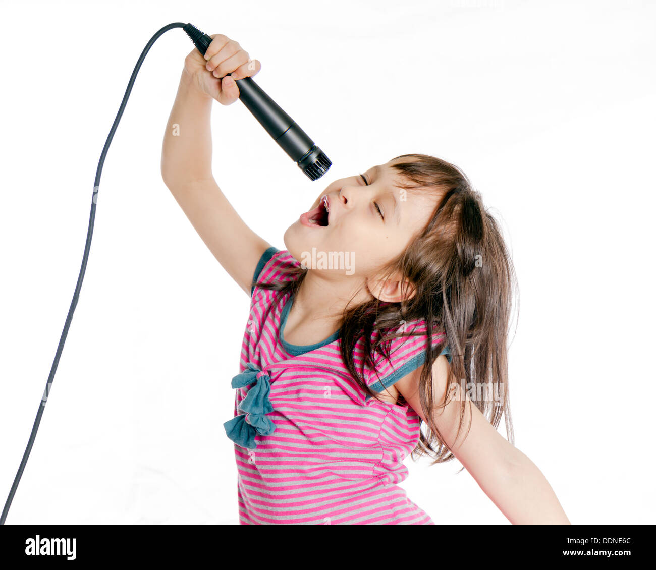 Asian female child singing with a microphone Stock Photo - Alamy