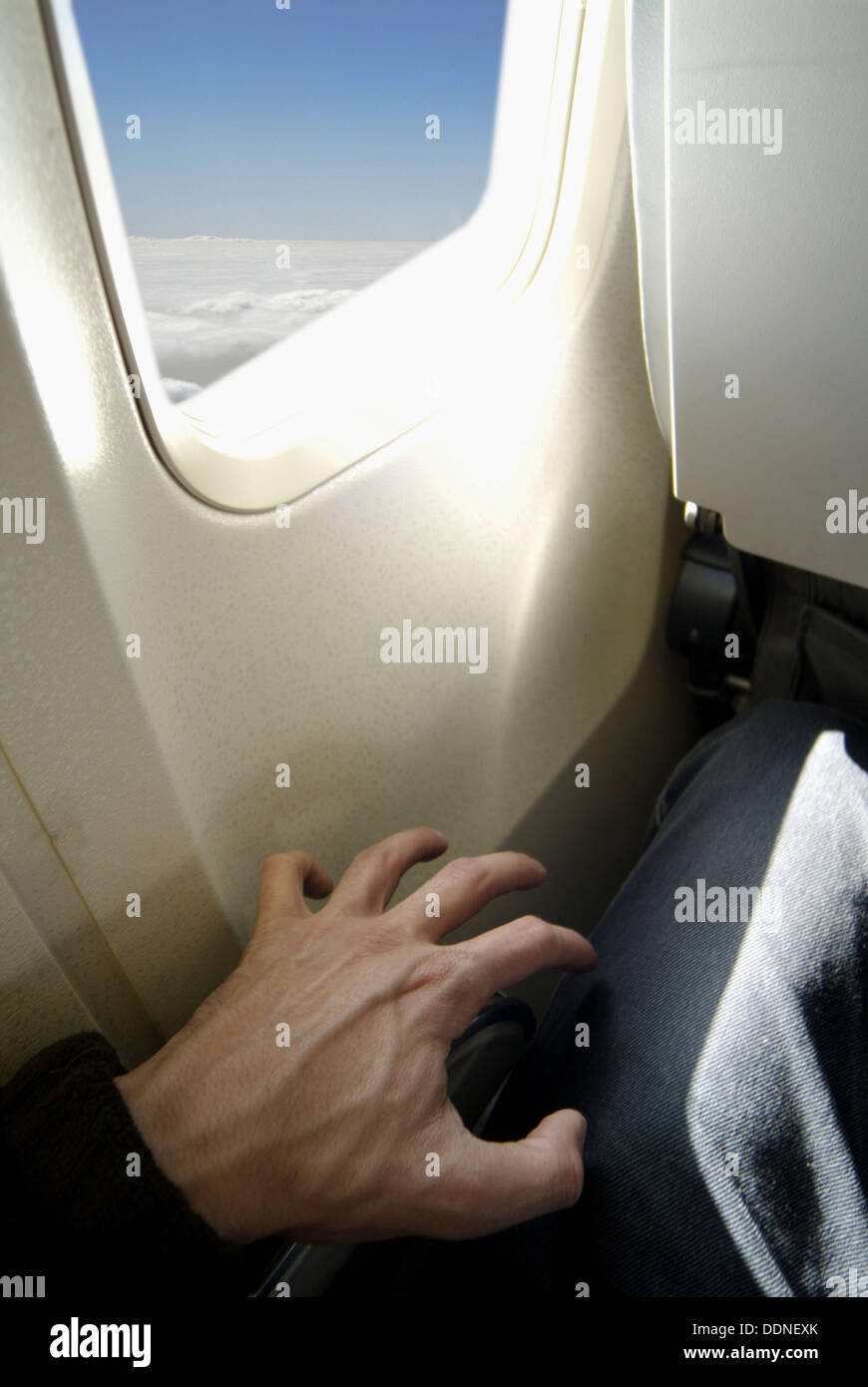 Human hand on airplane window hi-res stock photography and images - Alamy