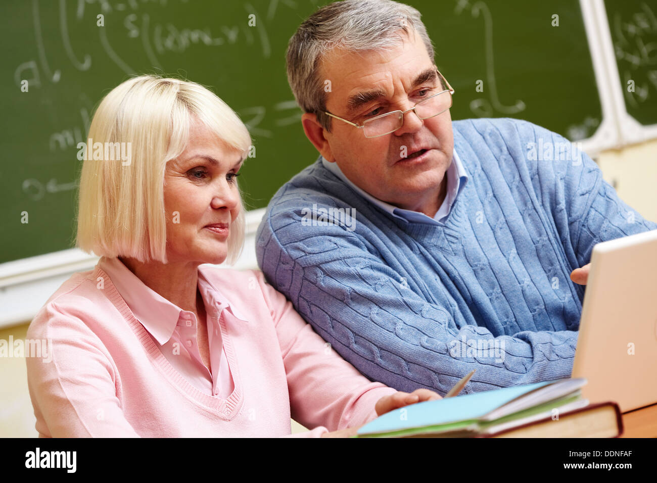 Elderly people using modern technologies for studying Stock Photo - Alamy