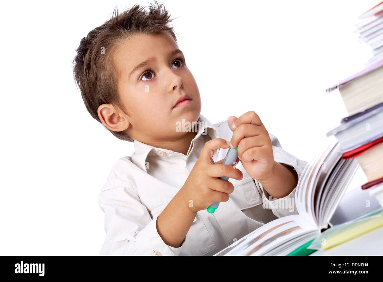 Portrait of smart school boy with highlighter thinking what to draw ...