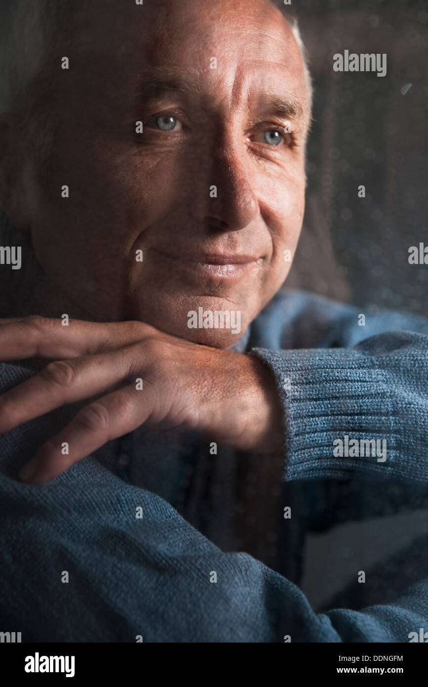 Mature man behind window pane Stock Photo - Alamy