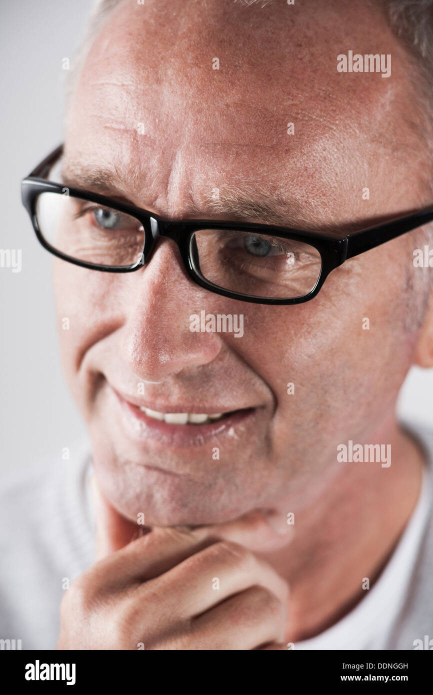 Smiling mature man wearing glasses Stock Photo - Alamy