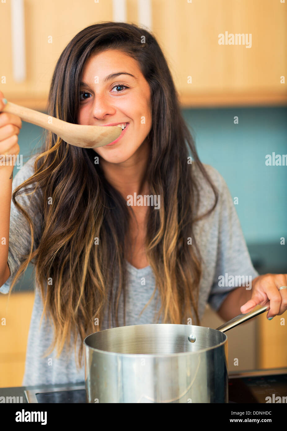 Beautiful Young Woman Cooking Dinner at Home In Kitchen, Lifestyle ...