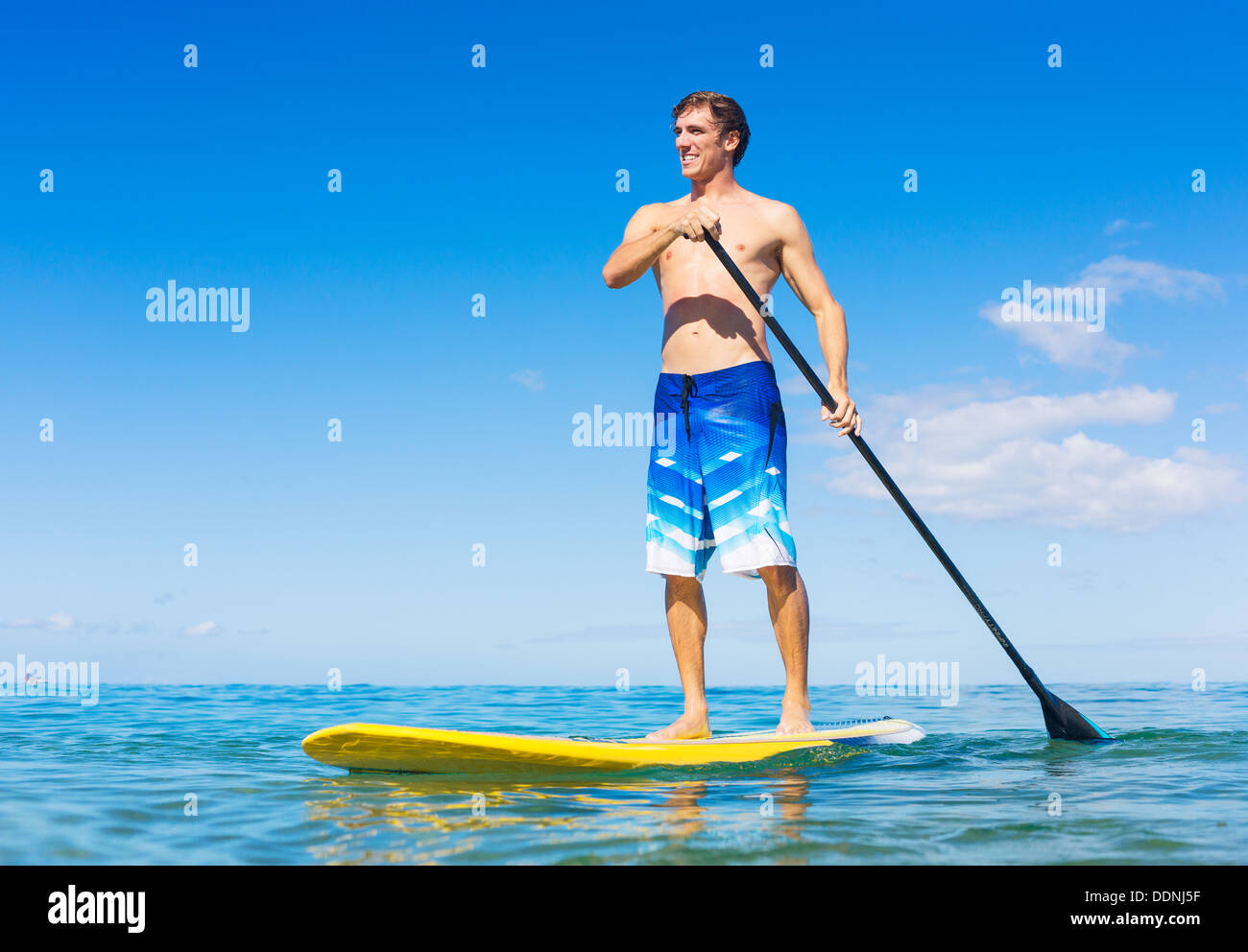 Man on stand up paddle board hi-res stock photography and images - Alamy