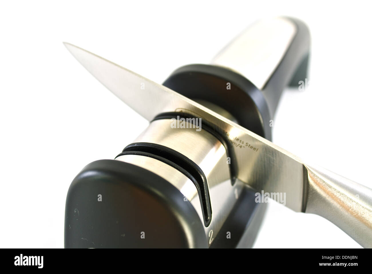Whetstone knife using the handle on white background Stock Photo - Alamy