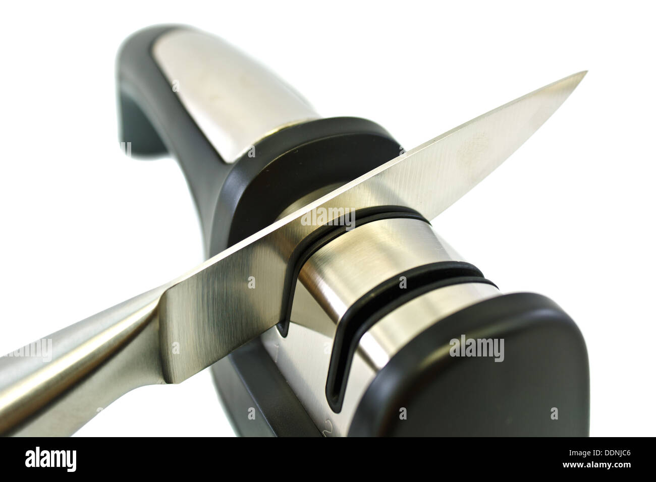 Whetstone knife using the handle on white background Stock Photo - Alamy