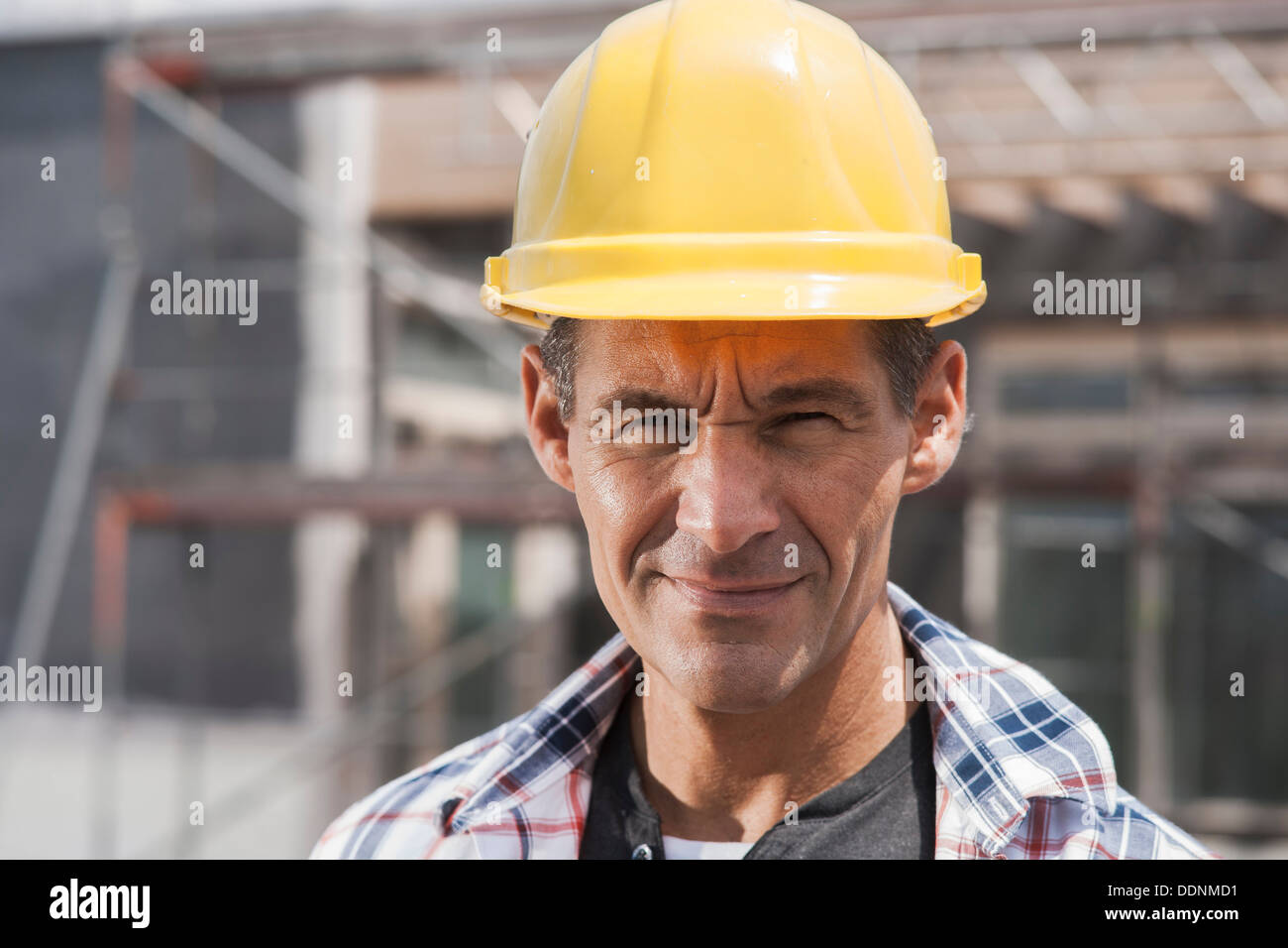 Builder on construction site, portrait Stock Photo - Alamy