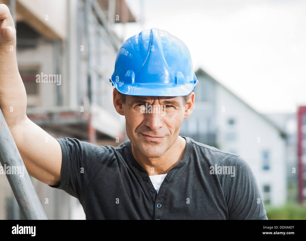 Builder on construction site, portrait Stock Photo - Alamy