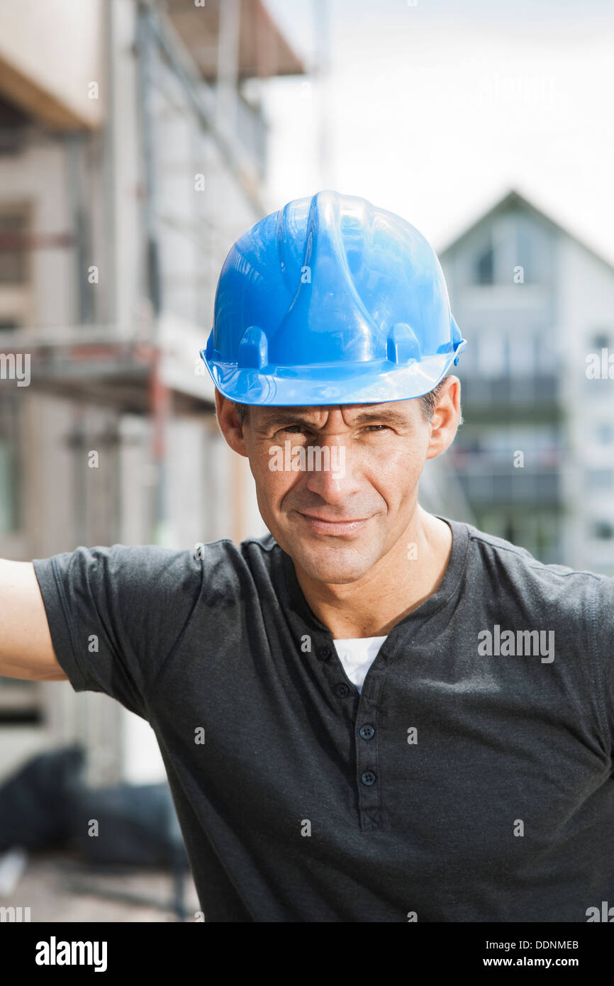 Builder on construction site, portrait Stock Photo - Alamy