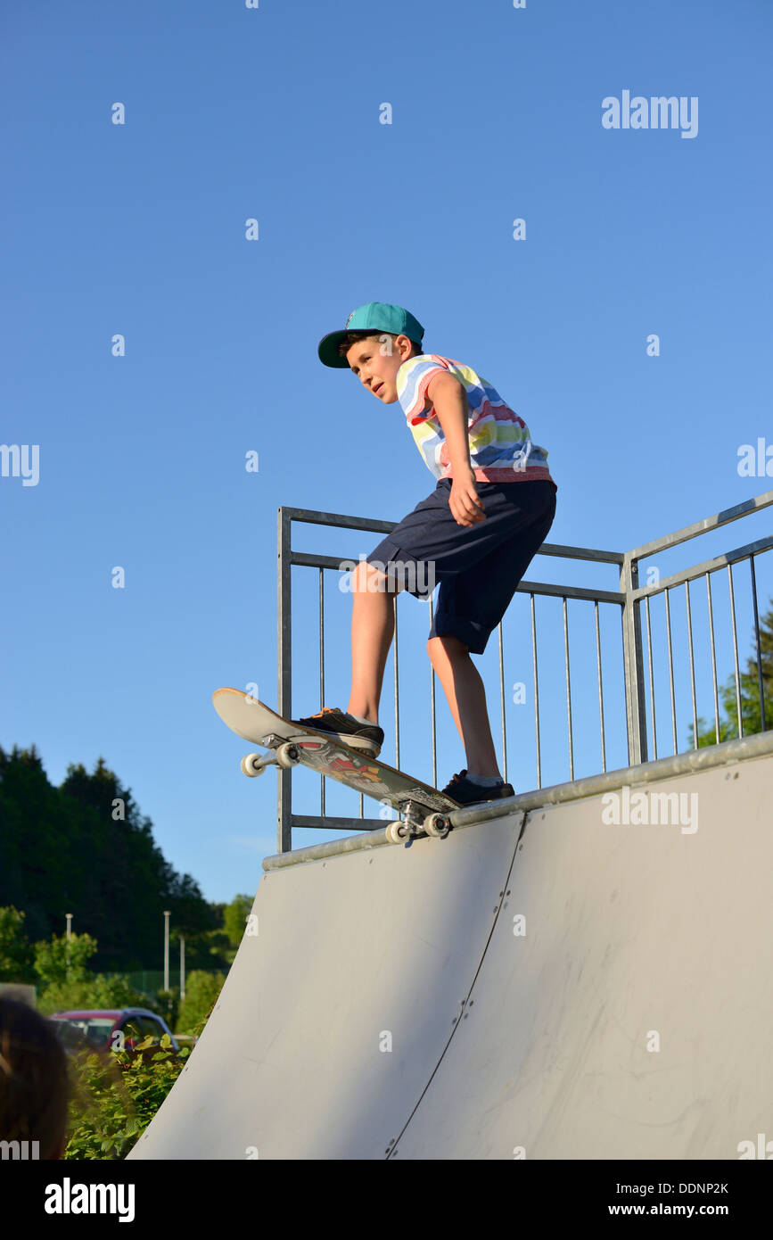 Boy with skateboard in a skatepark Stock Photo - Alamy