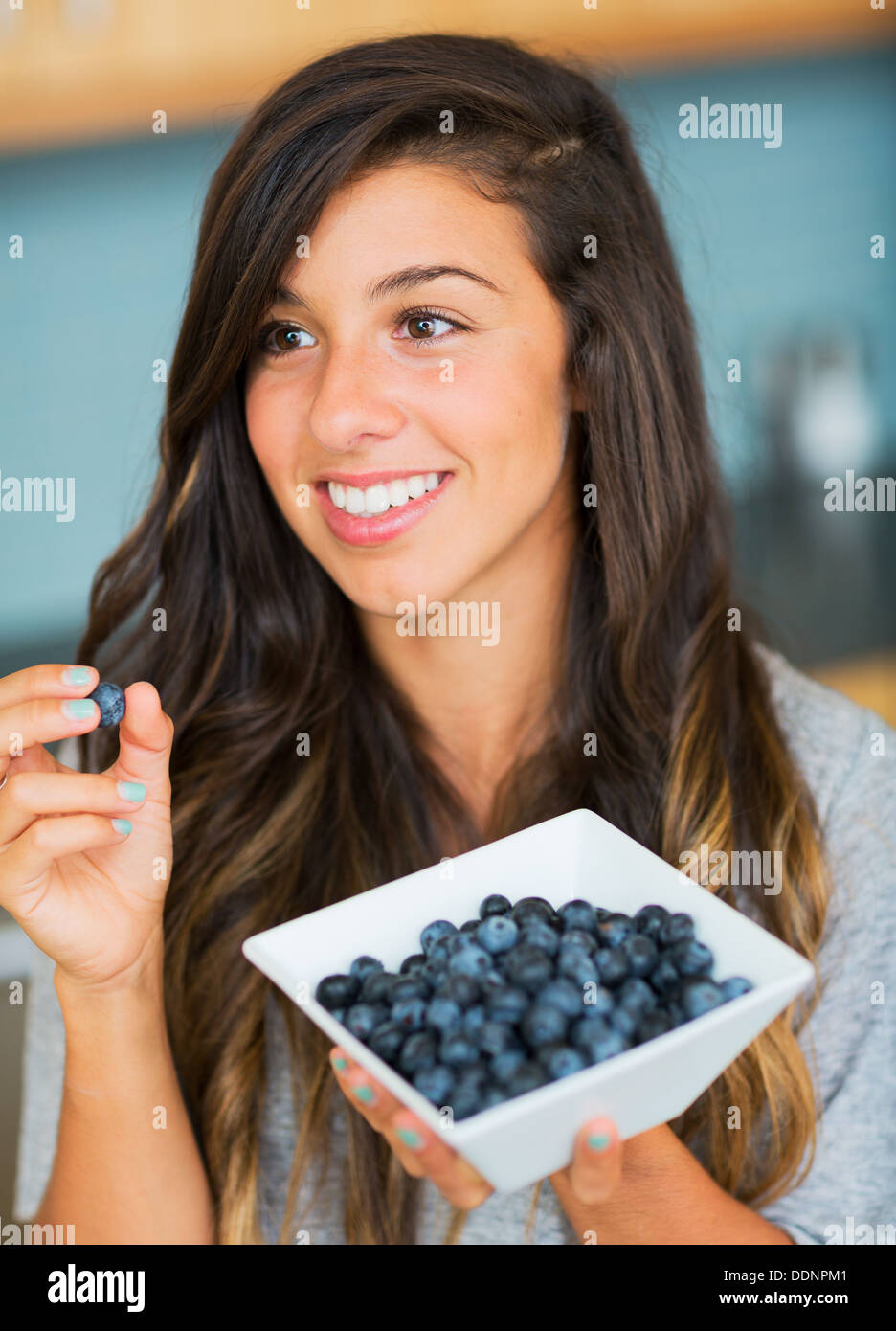 Beautiful woman eating blueberries, Healthy Food Lifestyle Stock Photo ...