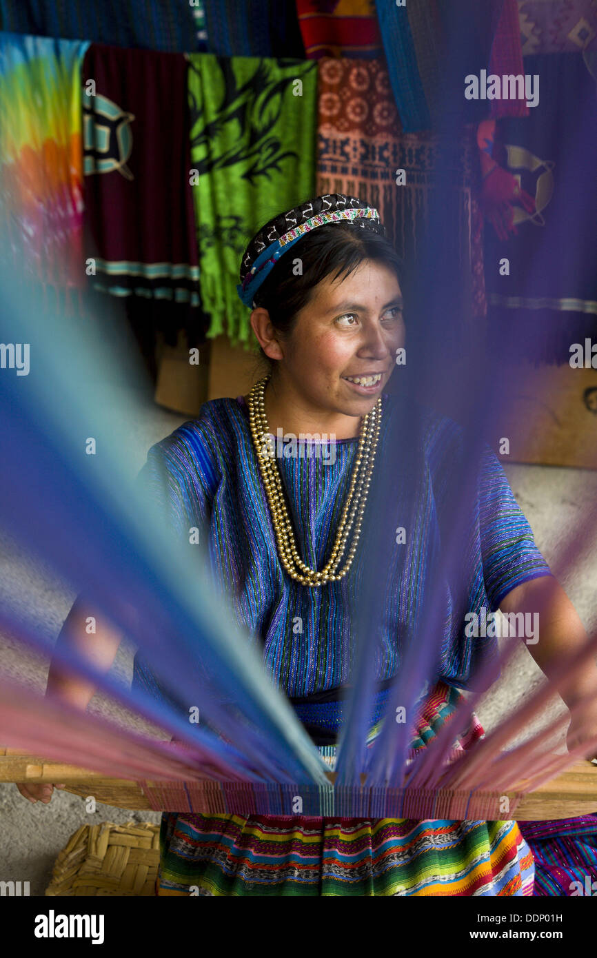 Woman using old weaving loom hi-res stock photography and images - Alamy