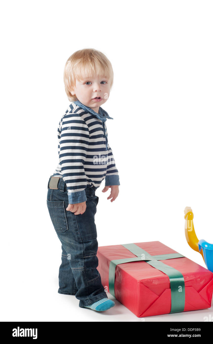 Little boy in striped clothes in studio Stock Photo - Alamy
