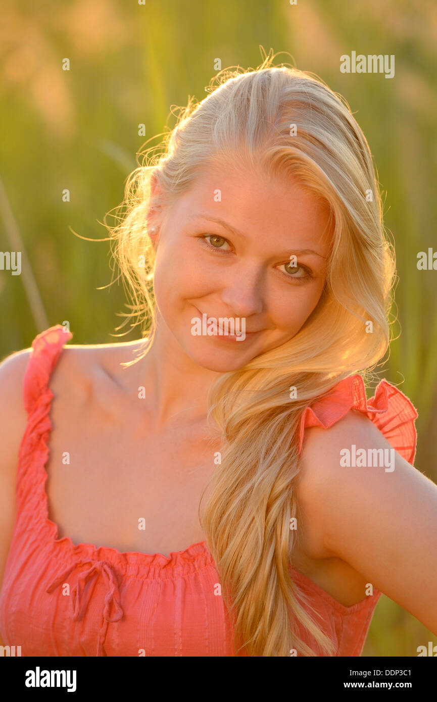 Young woman in the reeds, portrait Stock Photo - Alamy