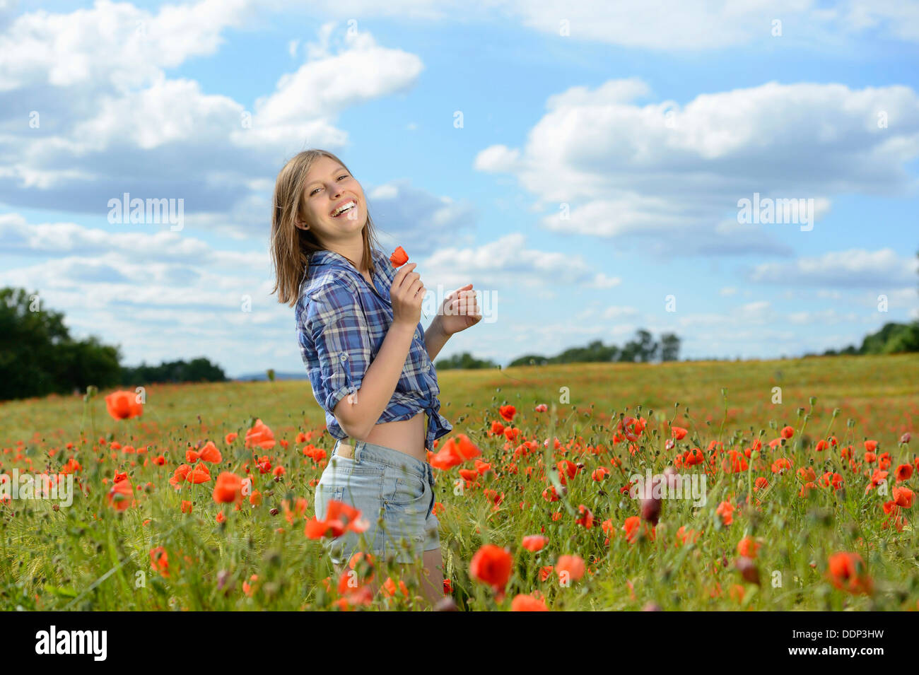 Woman standing holding facing camera hi-res stock photography and ...
