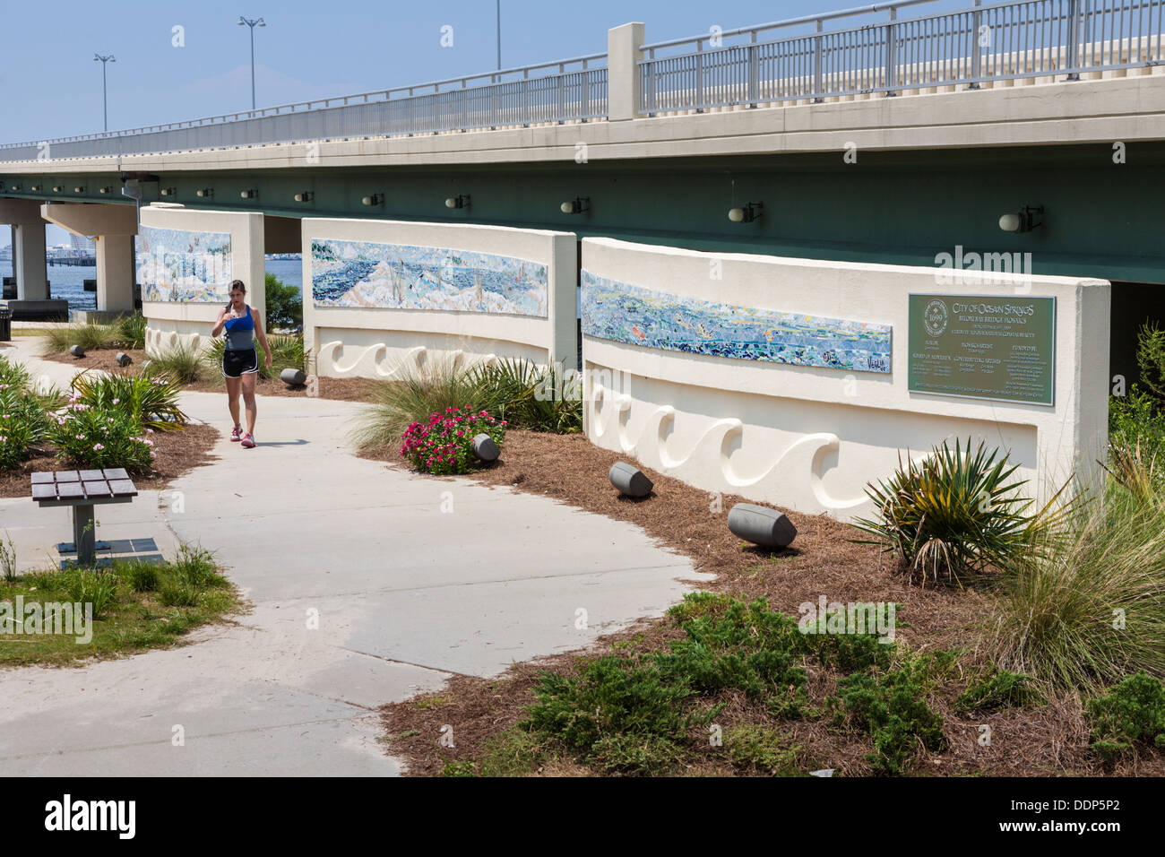 Woman walking at the Ocean Springs end of the Biloxi Bay Bridge in ...