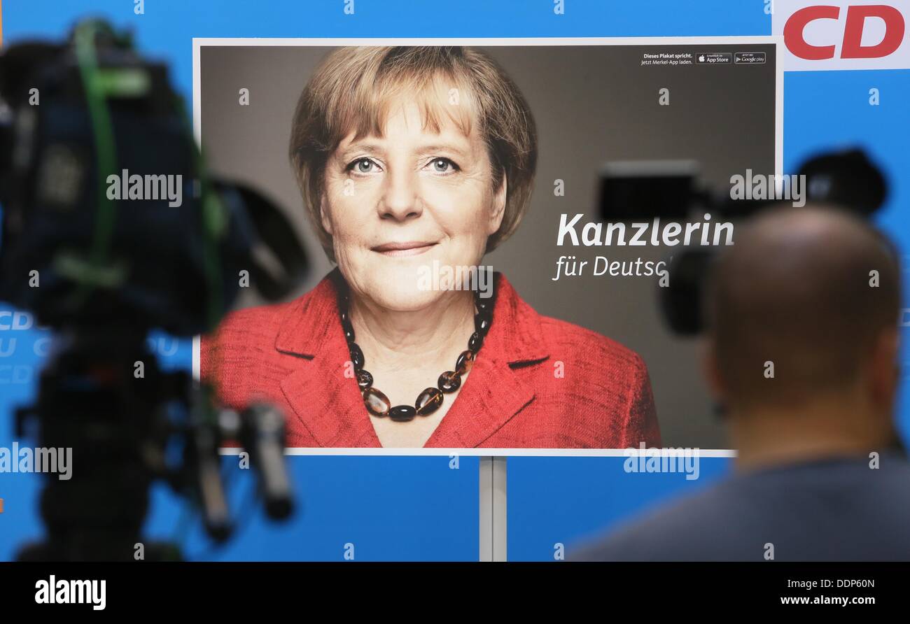 Cameras stand in front of a newly presented election poster with the ...