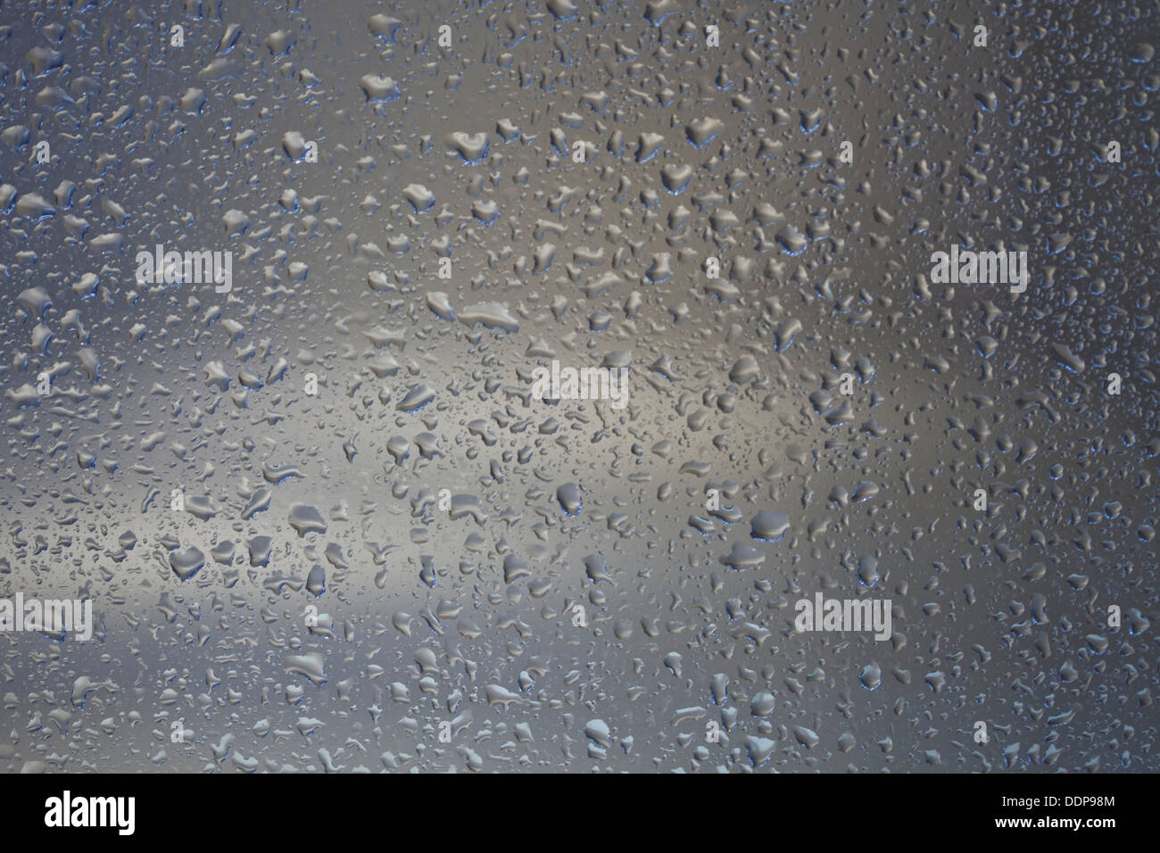 Raindrops on windowpane Stock Photo - Alamy
