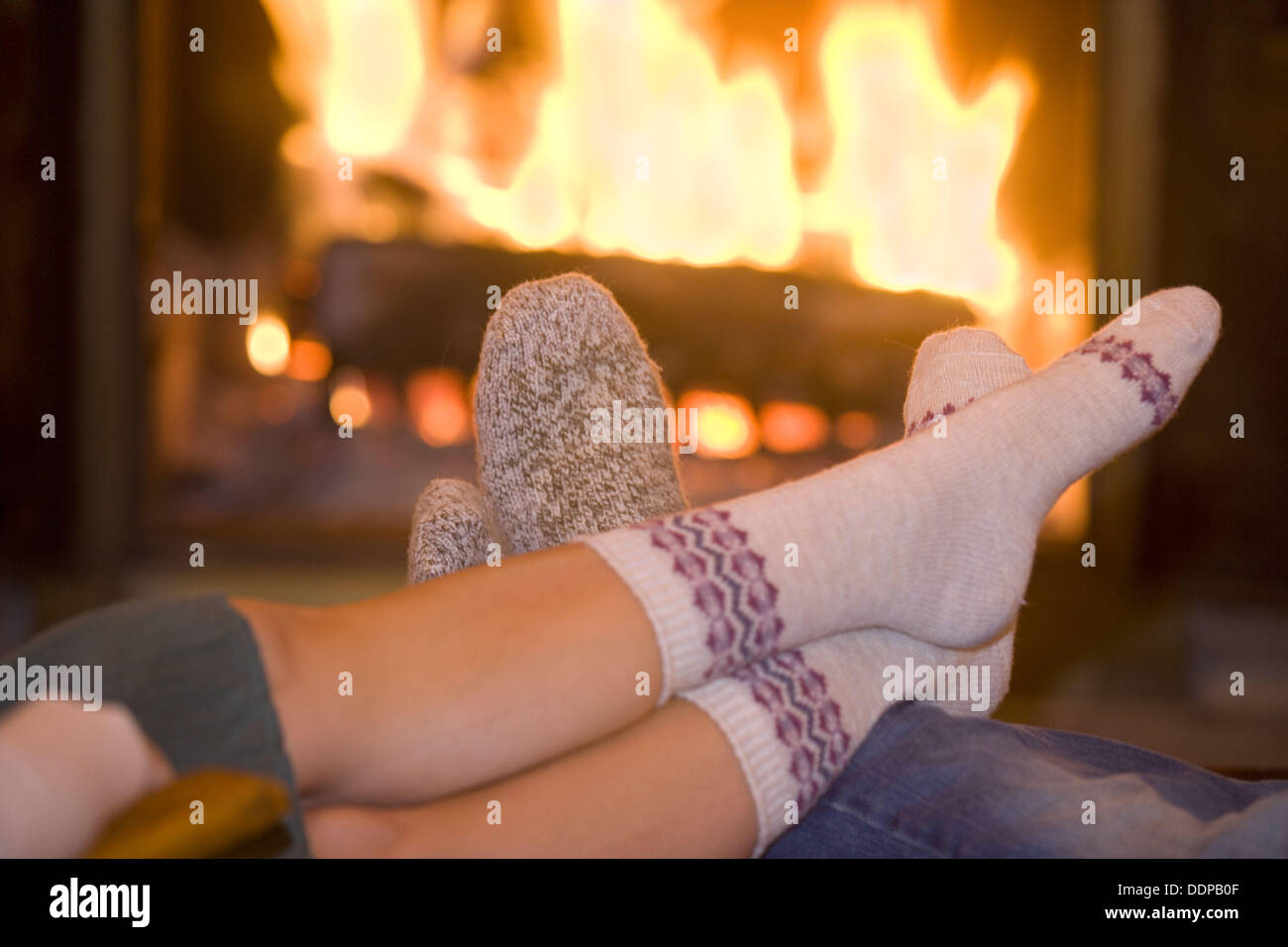 Pair at the fireside hi-res stock photography and images - Alamy