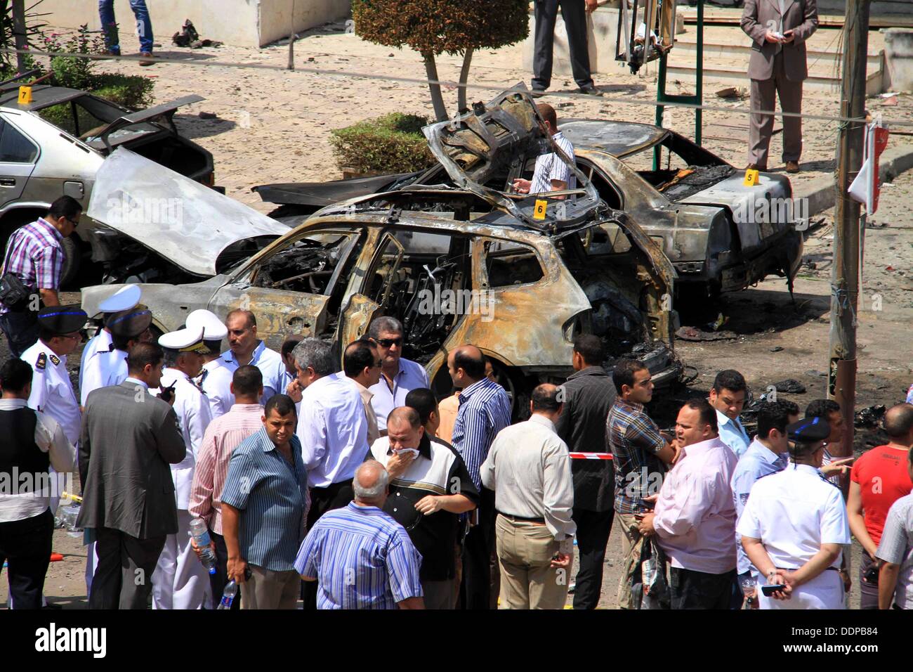 Cairo, Cairo, Egypt. 5th Sep, 2013. Egyptian security personnel gather at the scene of a bomb ...