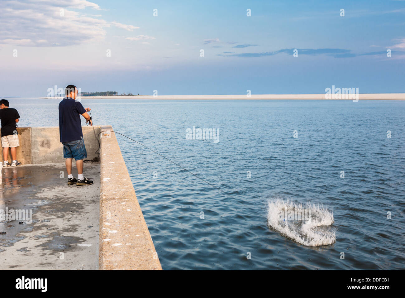 Man Throwing Cast Net On High Resolution Stock Photography and Images ...