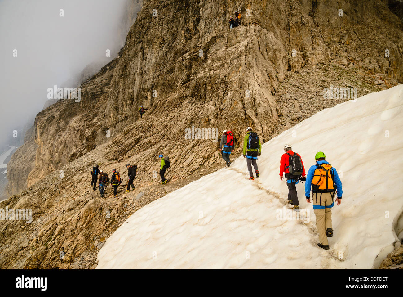 Climbers approaching the Rotstock Via Ferrata. The Rotstock is a small ...