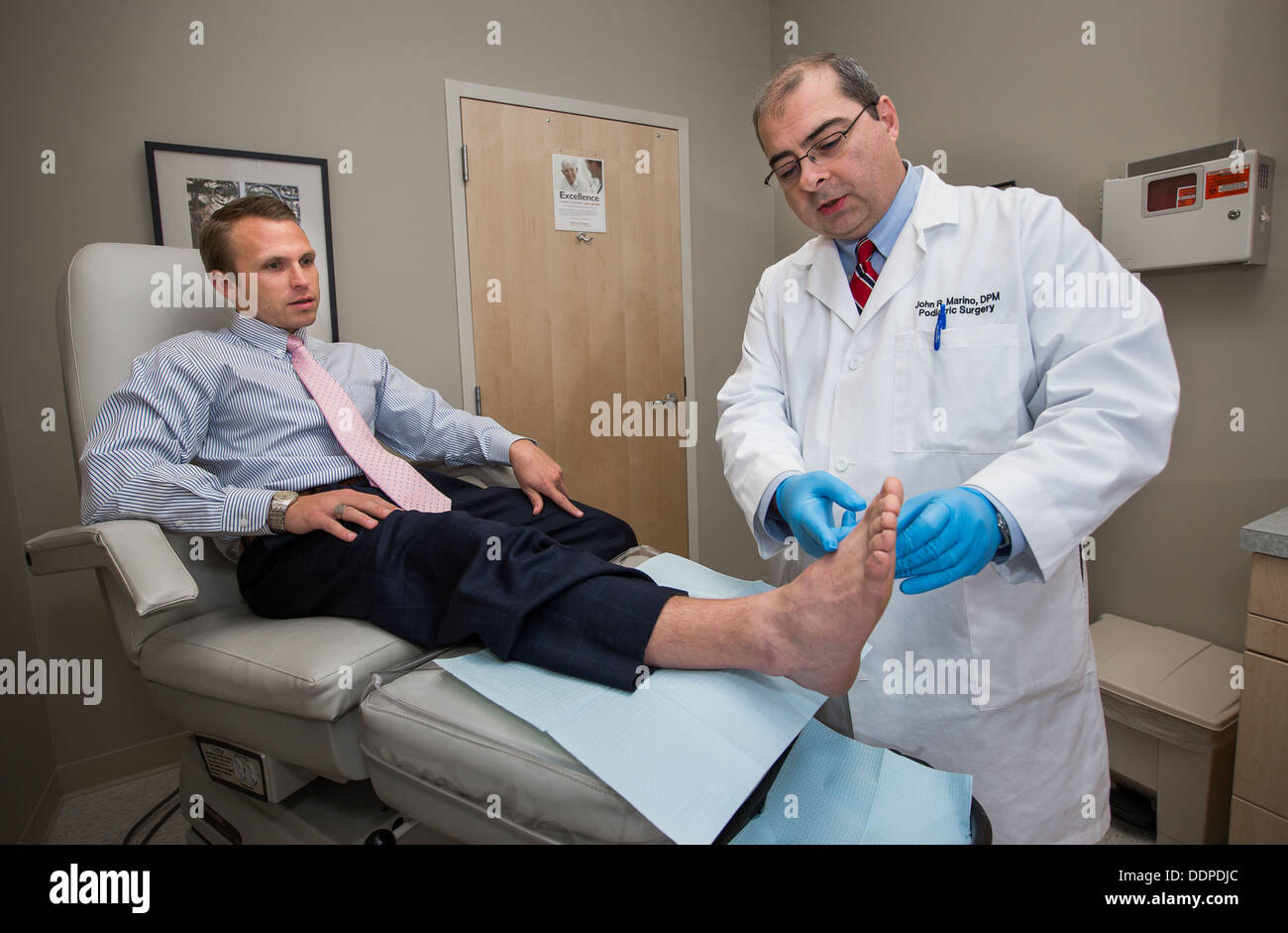Doctor examines a patient's foot Stock Photo - Alamy