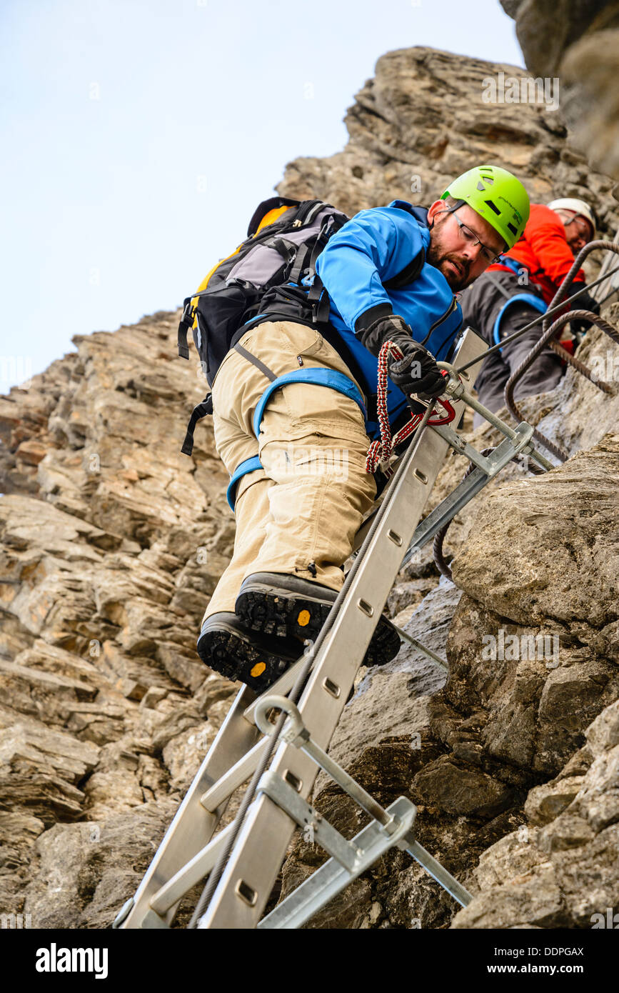 Climbers on the Rotstock Via Ferrata. The Rotstock is a small ...
