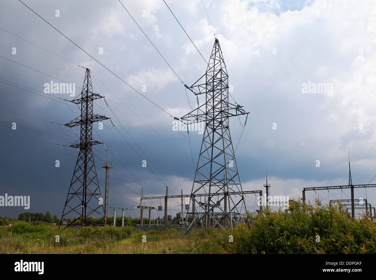 High voltage electrical towers against stormy sky Stock Photo - Alamy