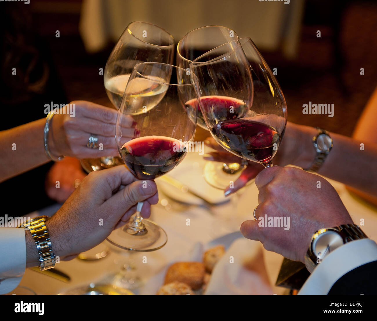 Diners Toasting with Glasses of Wine Stock Photo - Alamy