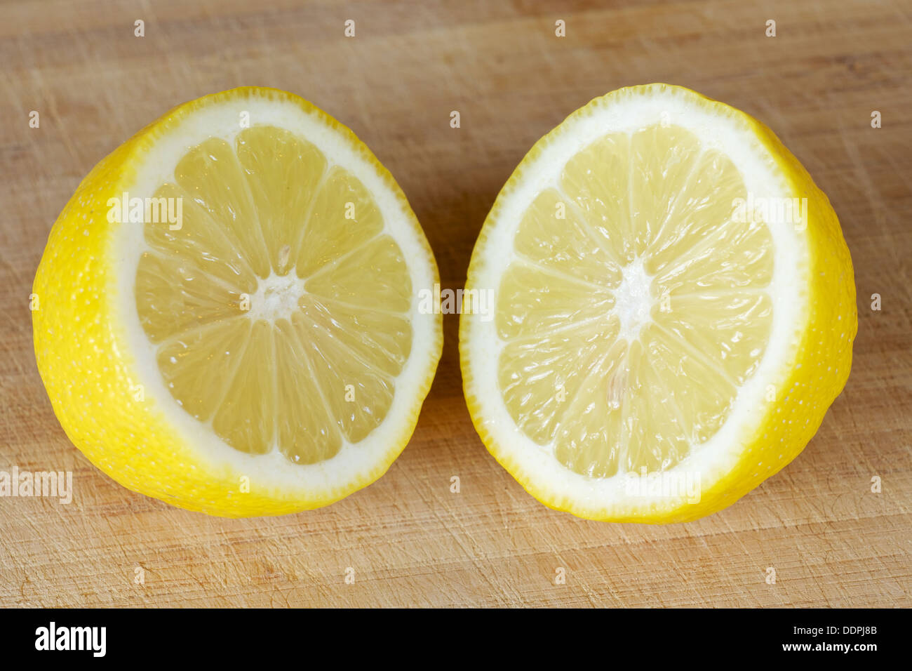 Lemon sliced in two Stock Photo - Alamy