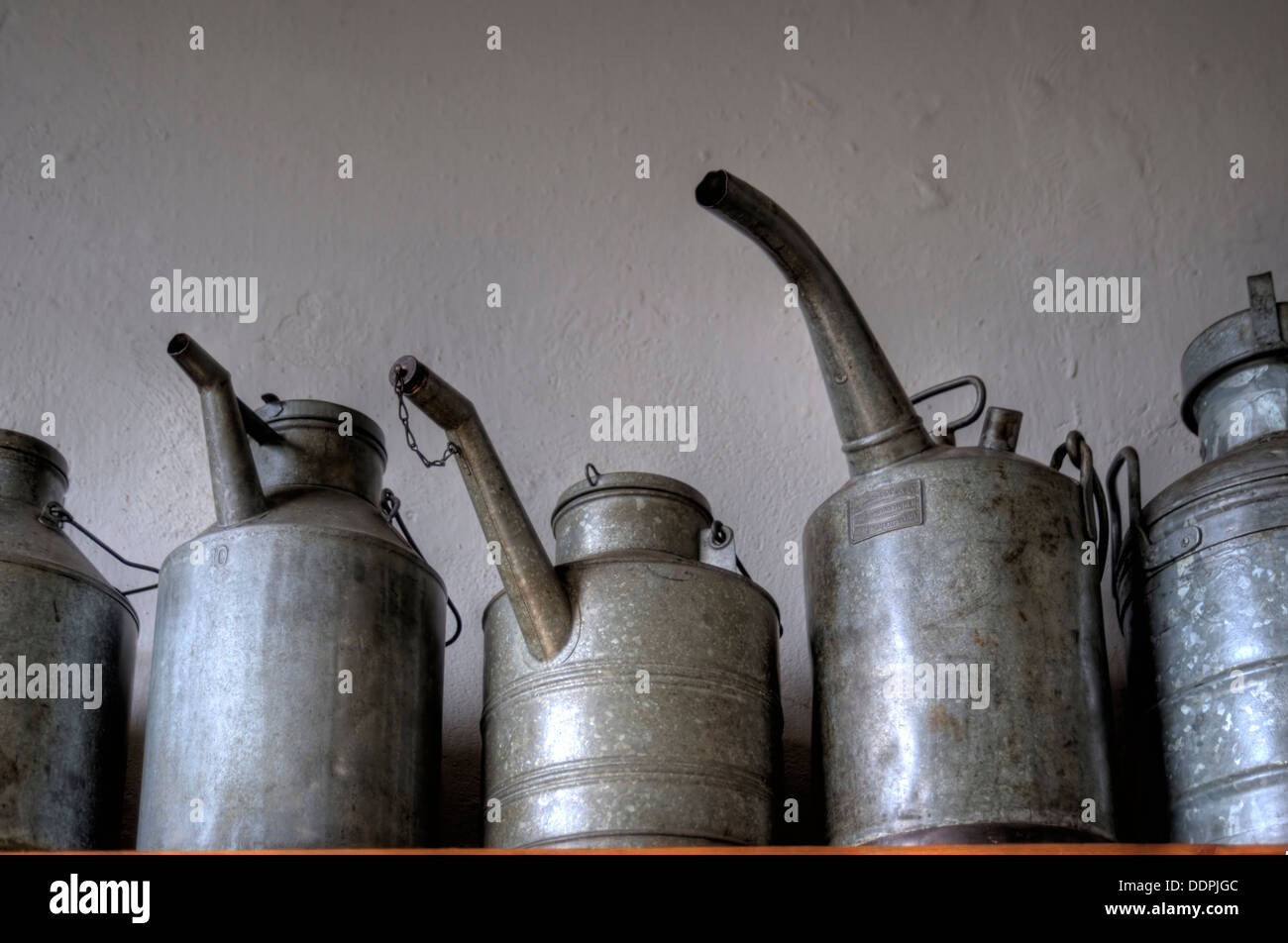 Oil cans in a garage Stock Photo - Alamy
