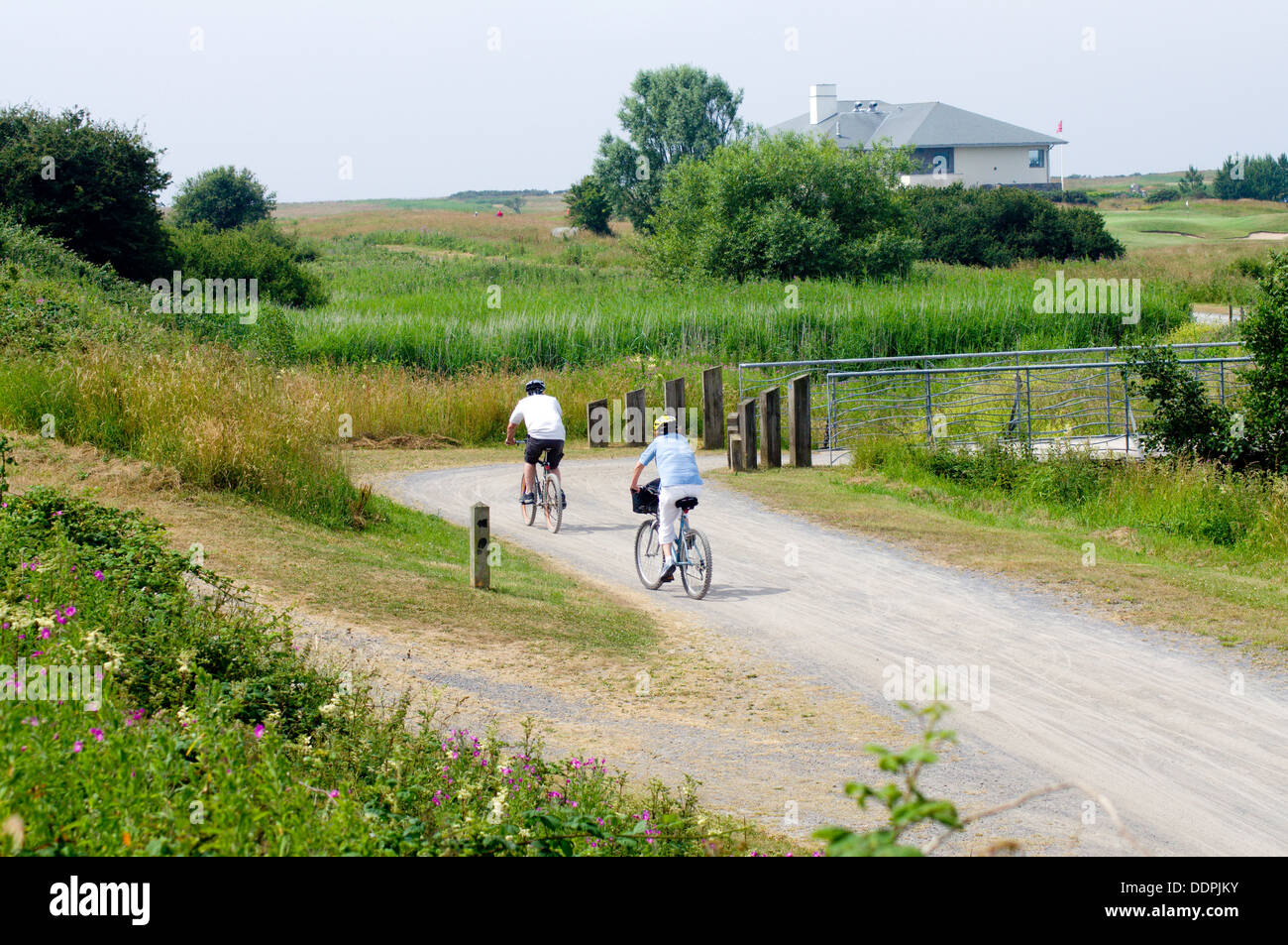 Couple cycling along Millennium coastal path, Machynys, Llanelli ...