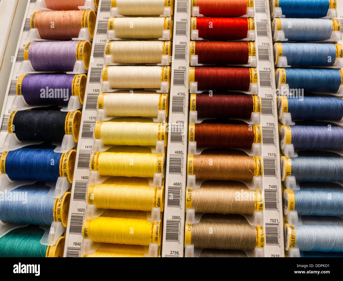 Blue yellow spools thread hi-res stock photography and images - Alamy