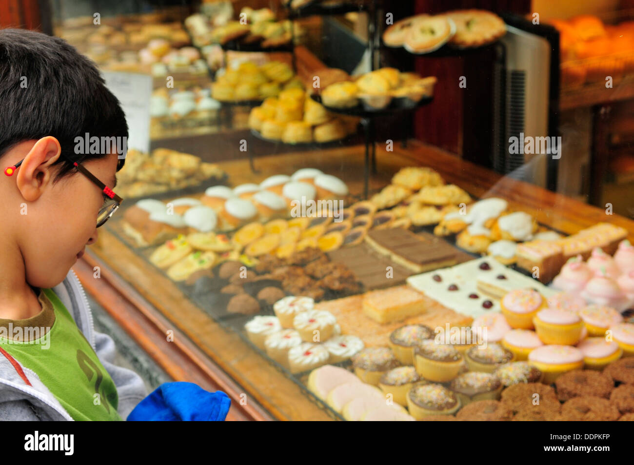 Kid at the Cake Shop Stock Photo - Alamy