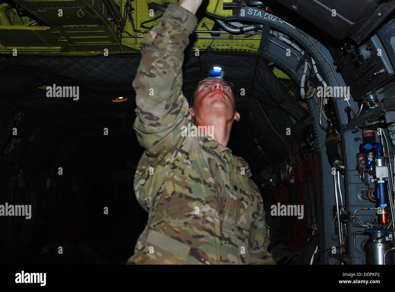 Spc. Tyler McConnell, a CH-47 Chinook helicopter crew chief assigned to ...
