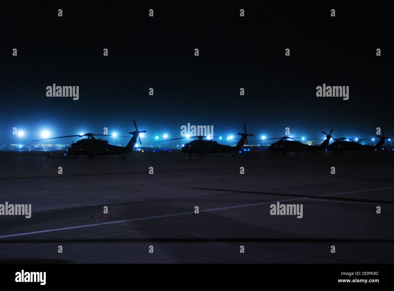 UH-60 Black Hawk helicopters from Task Force Falcon sit on the flight ...