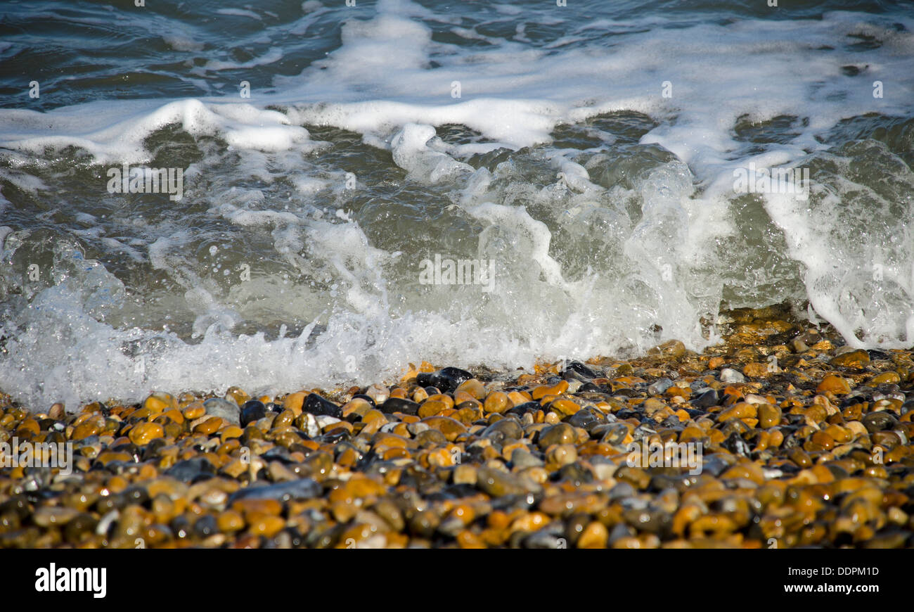 waves on shingle beach Stock Photo - Alamy