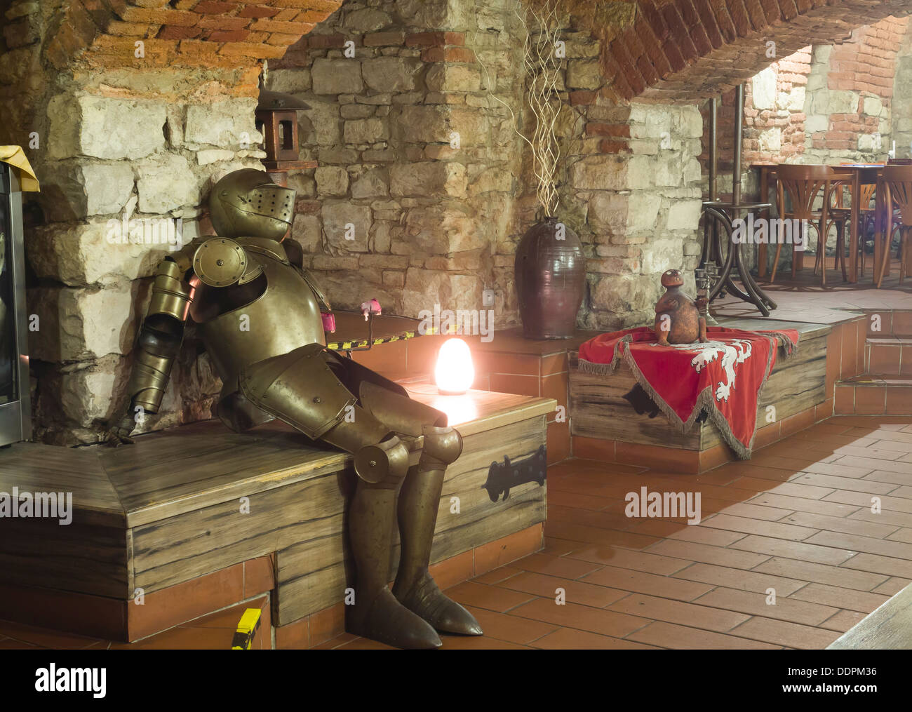 the knight's armor against the stone walls Stock Photo - Alamy