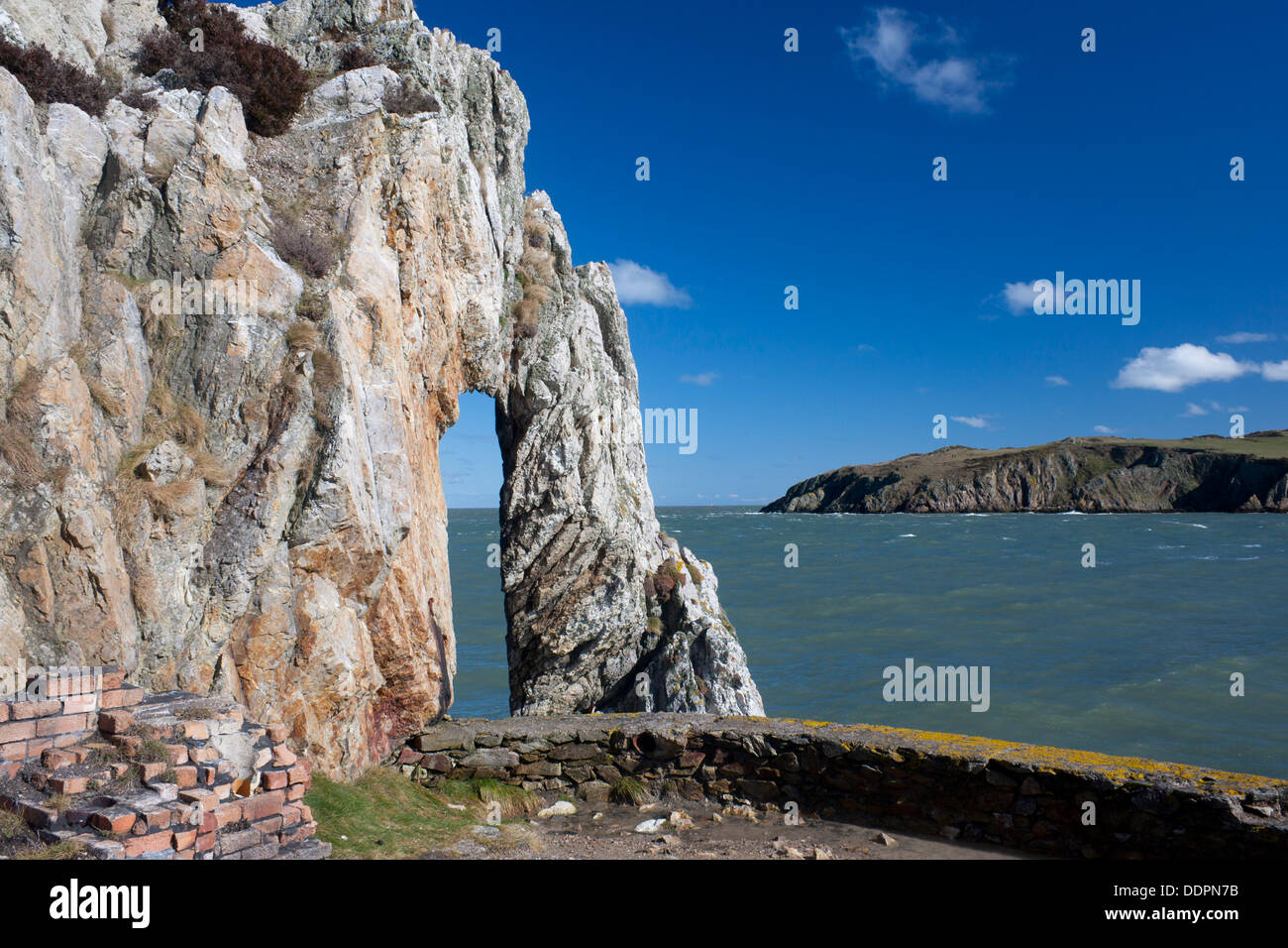 Natural sea rock arch at brickworks Porth Wen near Amlwch North coast ...